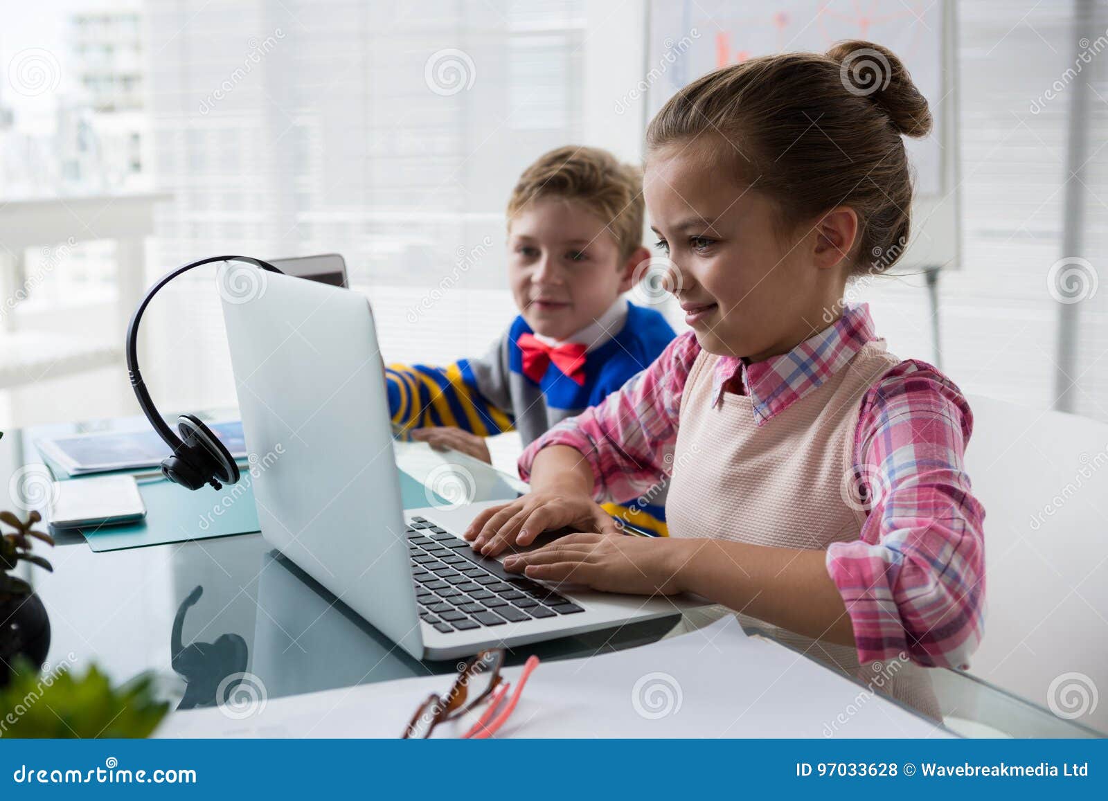Kids As Business Executive Interacting while Using Laptop Stock Photo ...