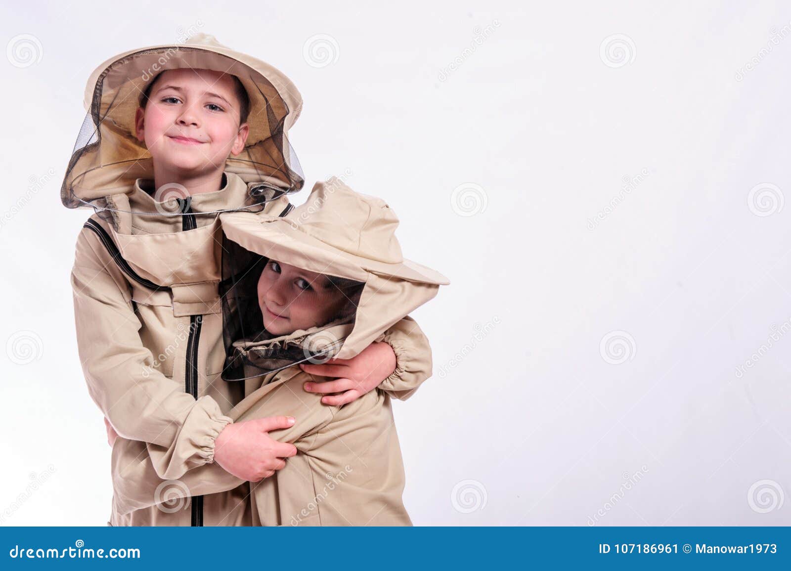 Kids in Beekeeper`s Suits Posing in Studio White Background. Stock ...