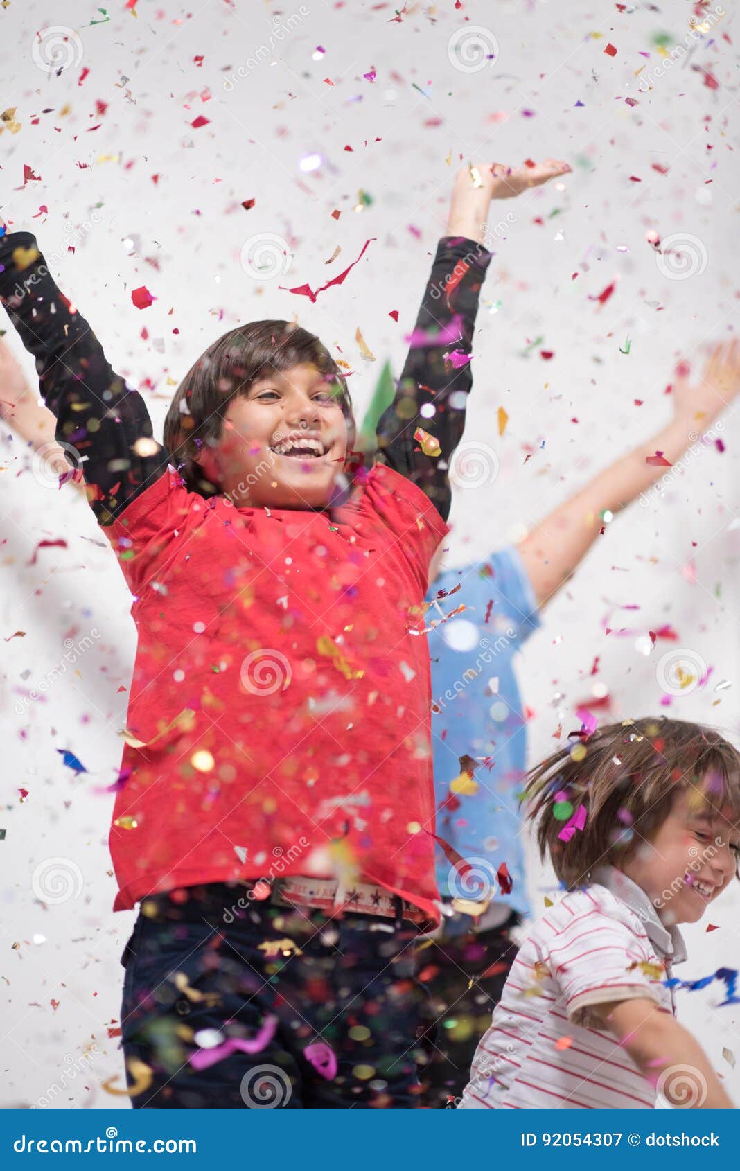Kids blowing confetti stock image. Image of face, group - 92054307