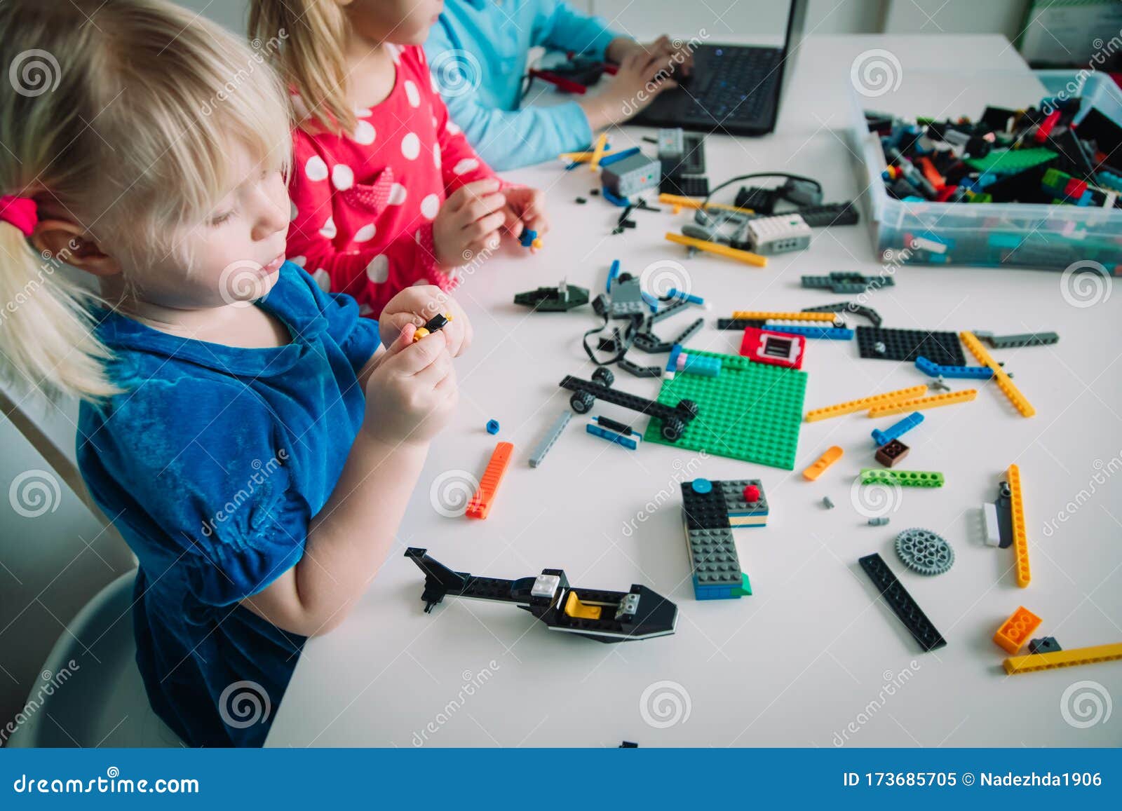 Kids Building Robot and Programming it on Computer Stock Image - Image ...