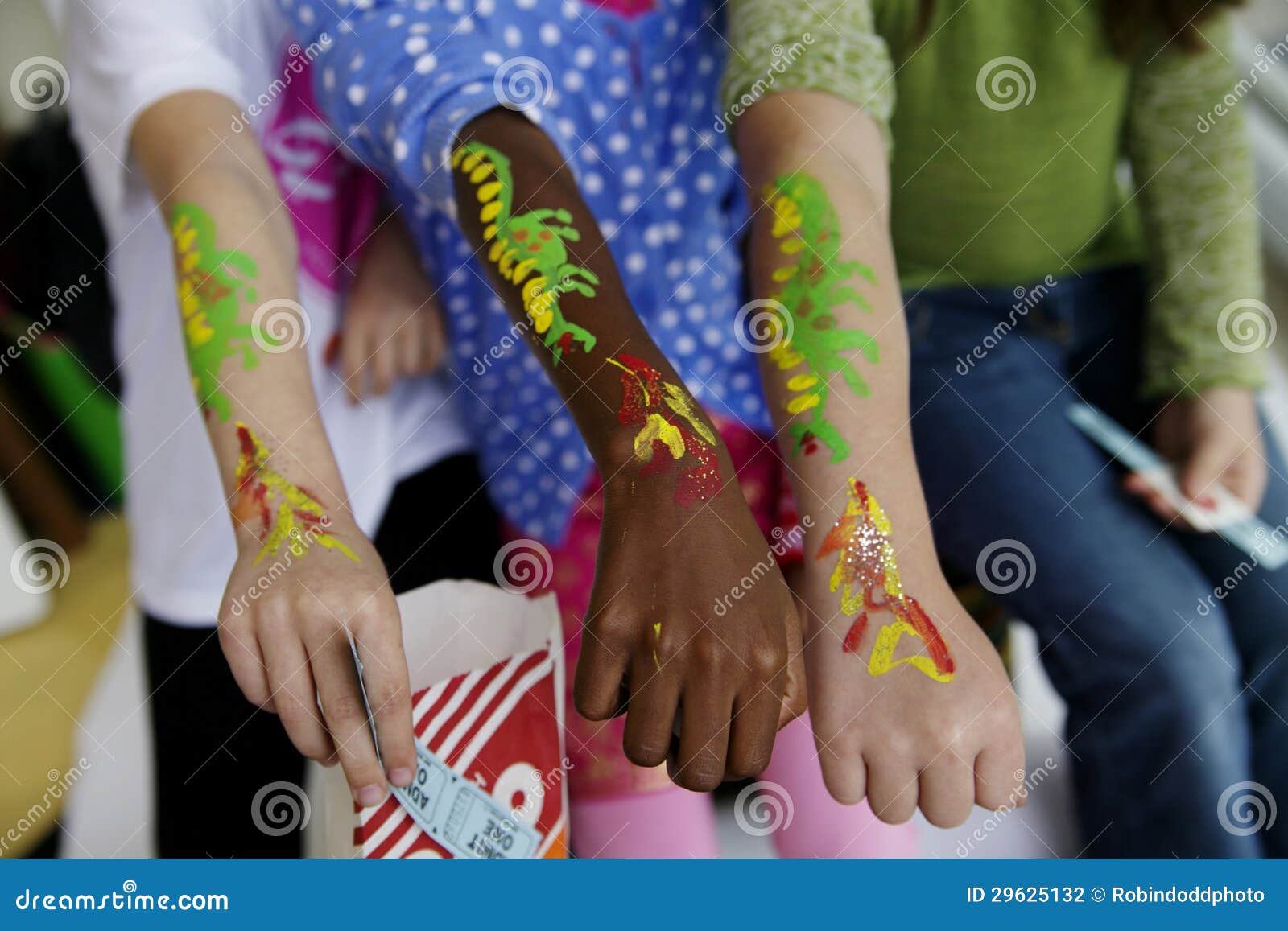 Kids Brightly Painted Arms at a Carnival Stock Photo - Image of kids ...