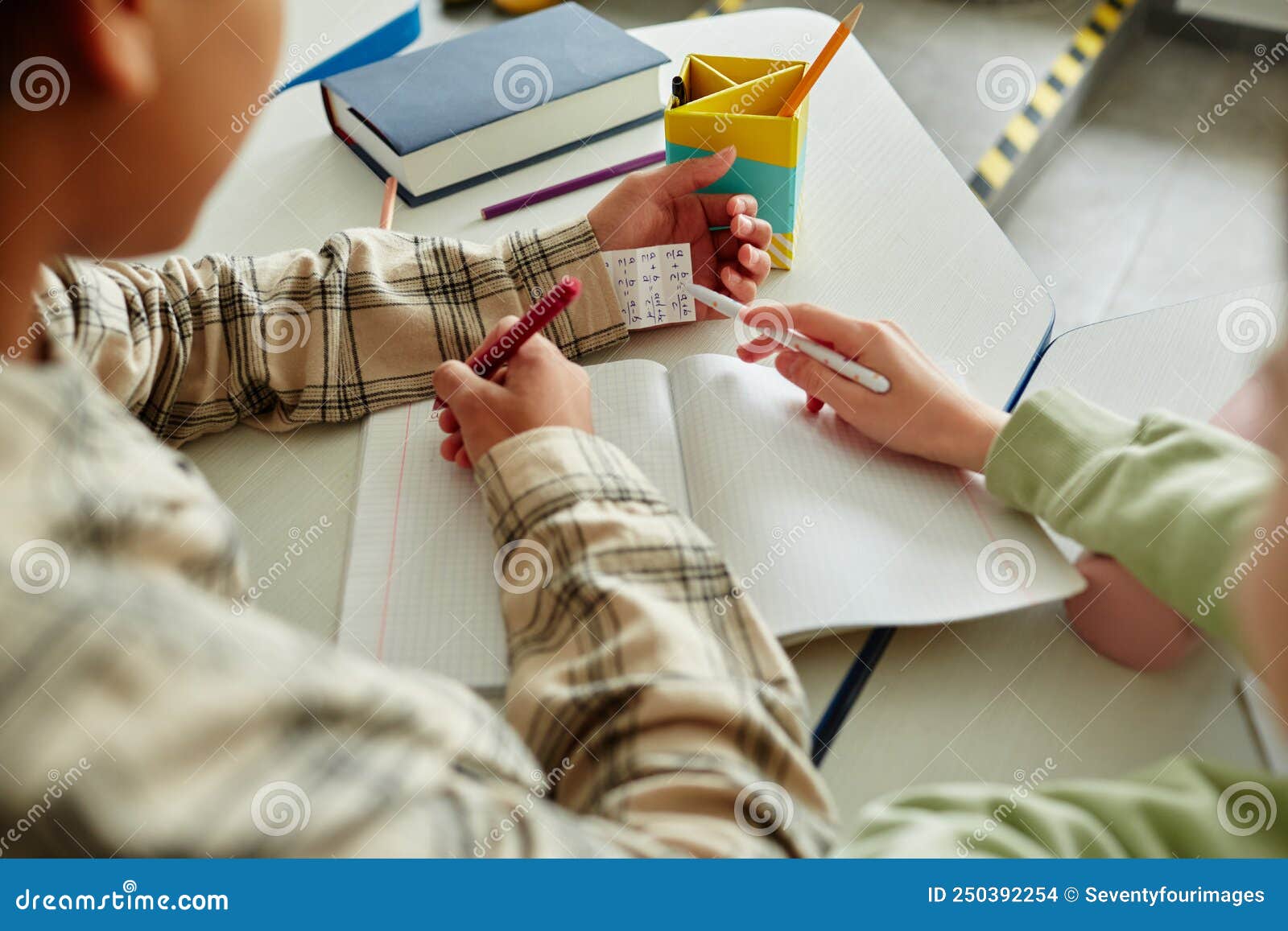 Kids Cheating in Class Close Up Stock Photo - Image of classroom ...