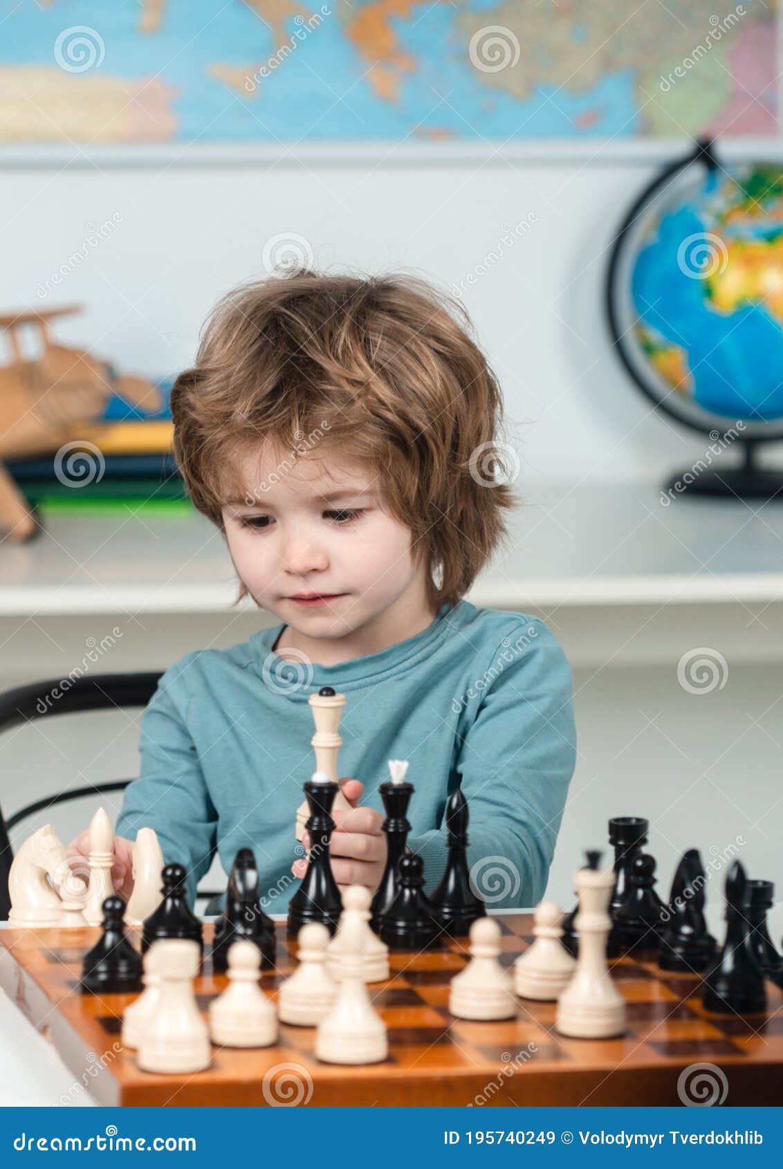 Kids Chess School. Concentrated Boy Developing Chess Strategy, Playing ...