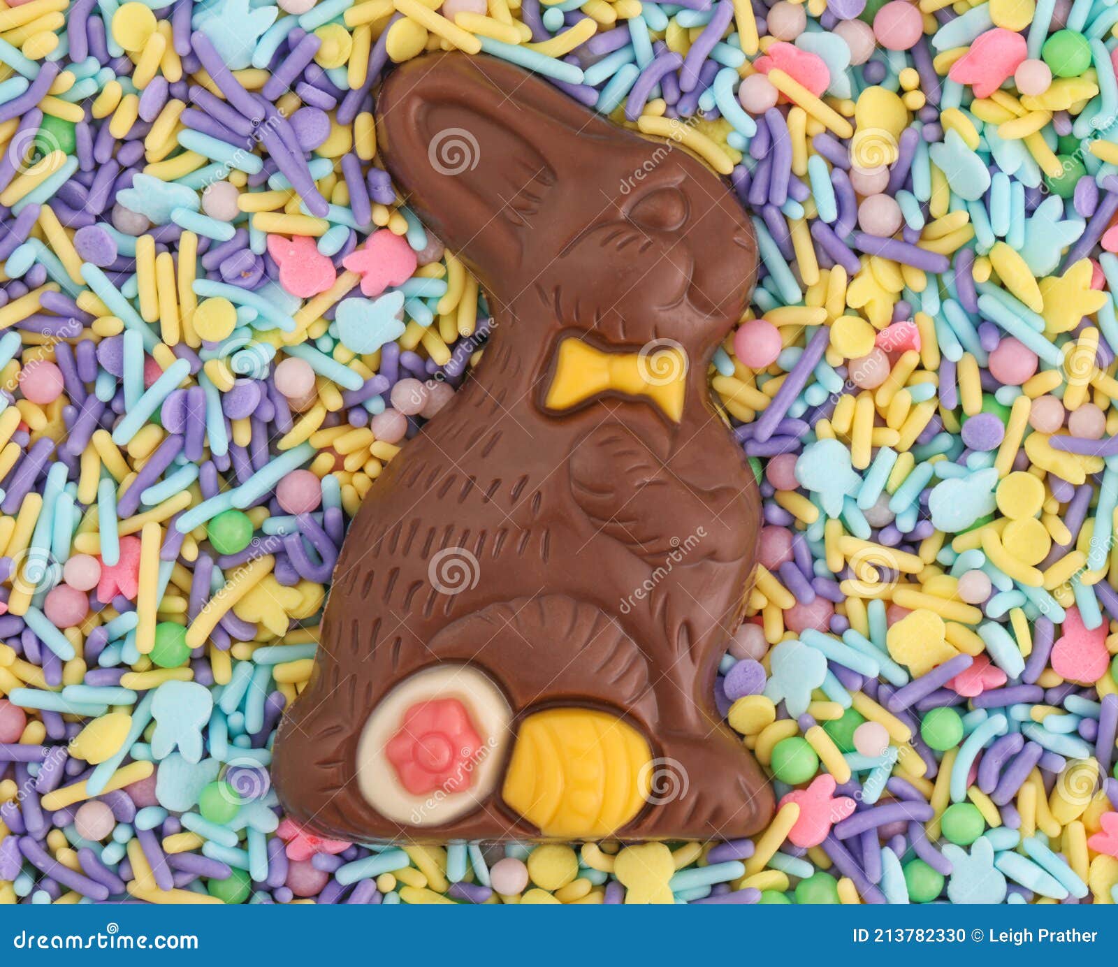 Chocolate Easter Bunny Rabbit on Colorful Easter Sprinkles Stock Photo ...