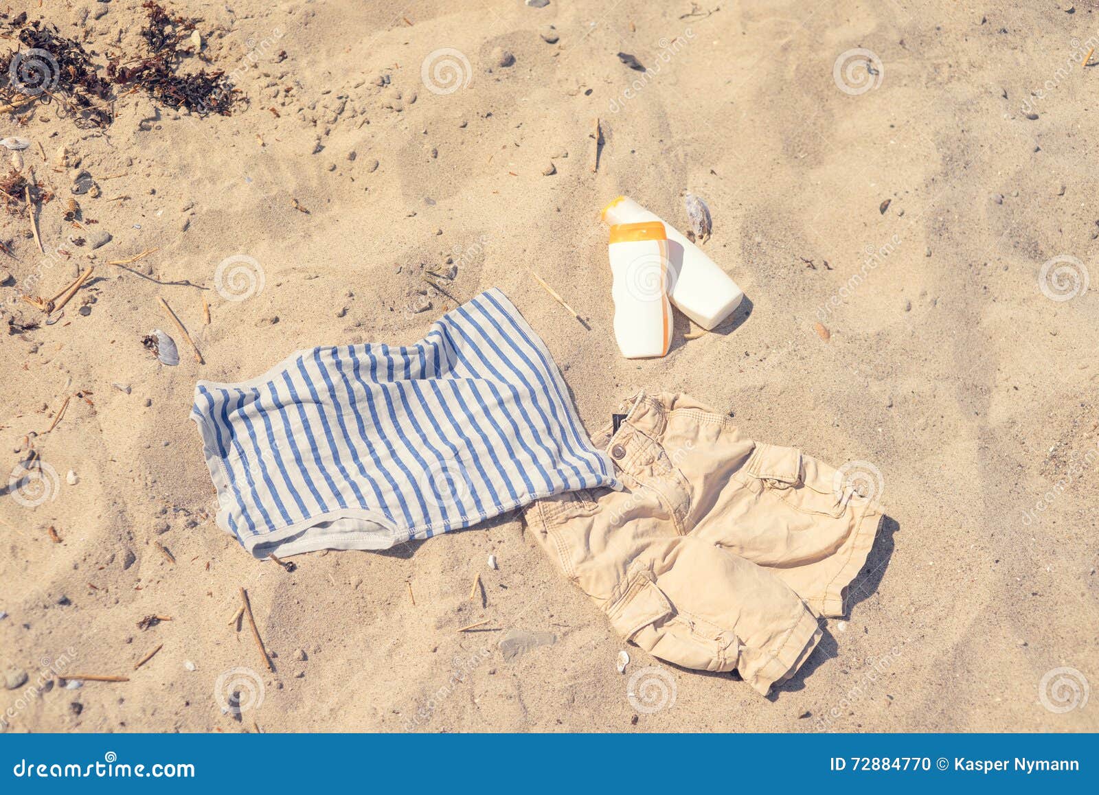 Kids Clothes on a Sandy Beach Stock Photo - Image of sand, seaside ...