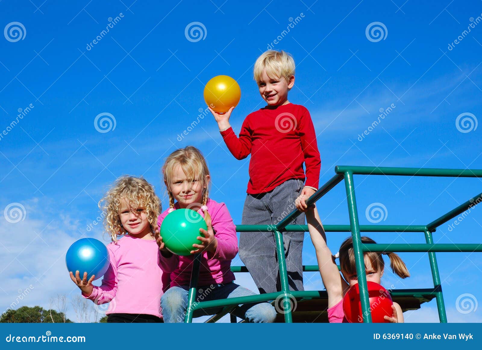 Kids with colorful balls stock photo. Image of group, four - 6369140