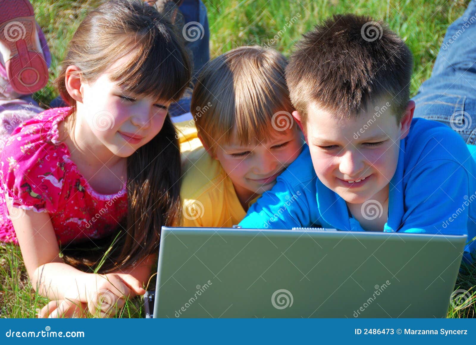 Kids with computer outside stock image. Image of resting - 2486473