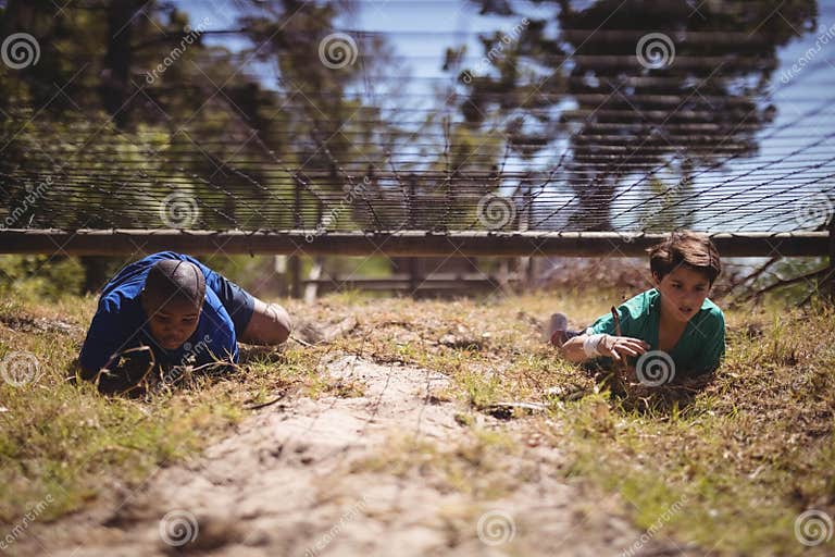 Kids Crawling Under the Net during Obstacle Course Stock Image - Image ...