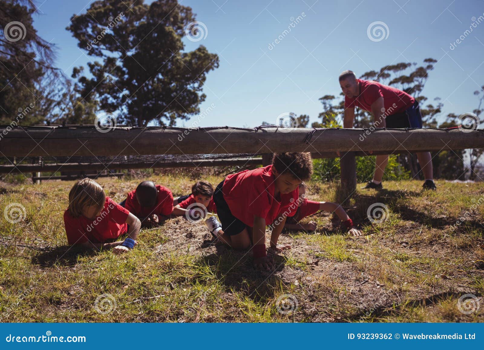 Kids Crawling Under the Net during Obstacle Course Training Stock Photo ...