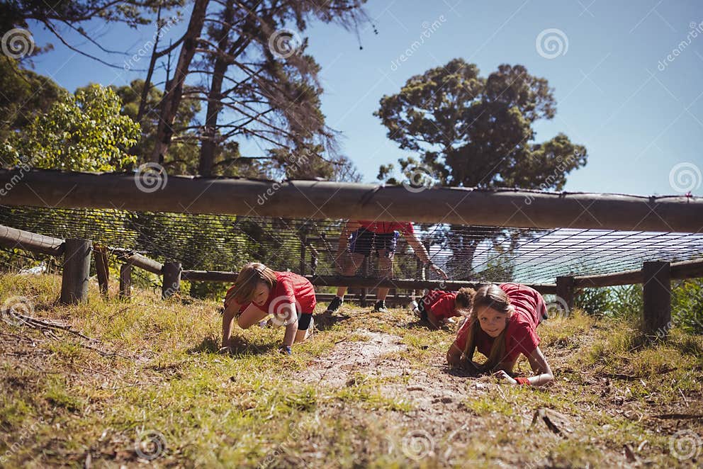 Kids Crawling Under the Net during Obstacle Course Training Stock Image ...