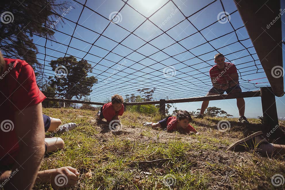 Kids Crawling Under the Net during Obstacle Course Training Stock Image ...