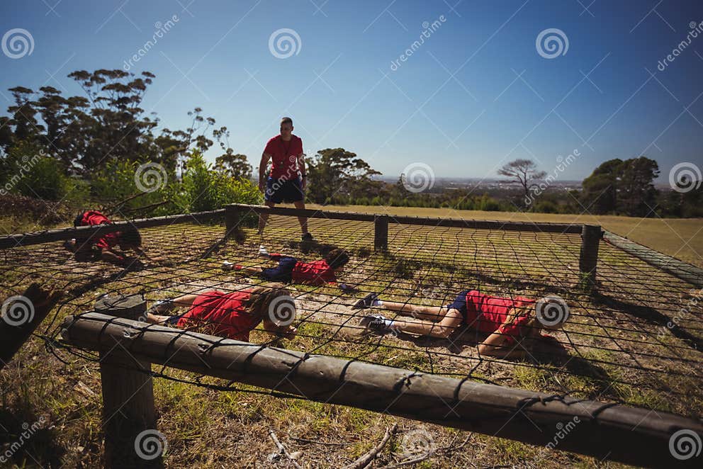 Kids Crawling Under the Net during Obstacle Course Training Stock Image ...