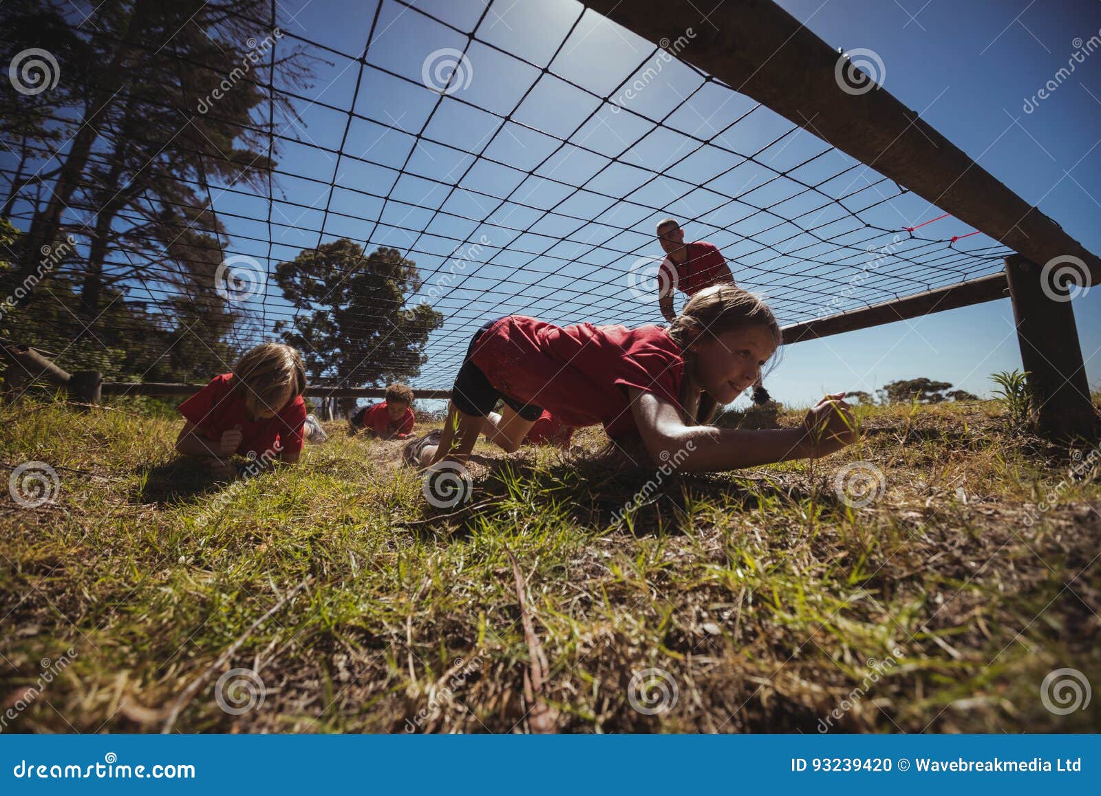 Kids Crawling Under the Net during Obstacle Course Training Stock Photo ...