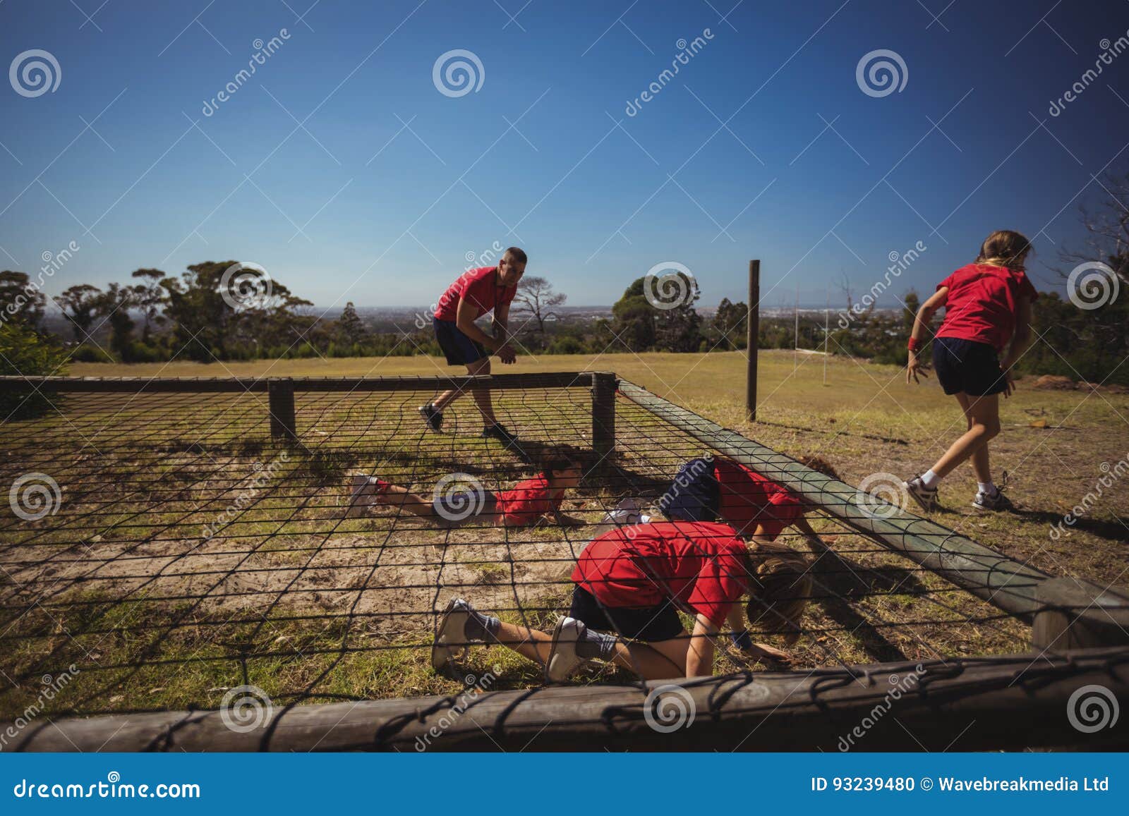 Kids Crawling Under the Net during Obstacle Course Training Stock Photo ...