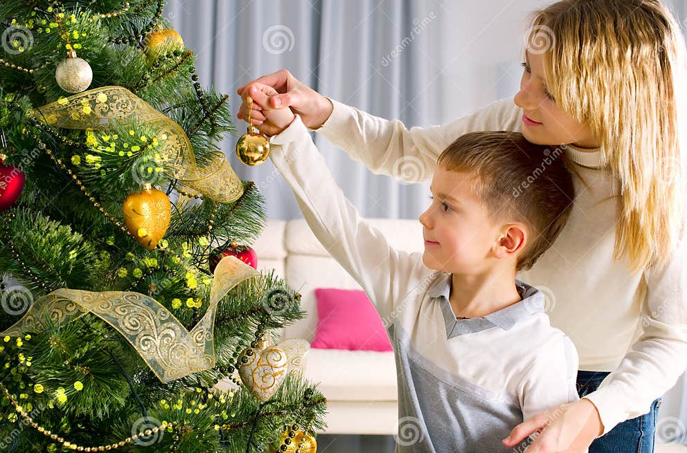 Kids Decorating a Christmas Tree Stock Image - Image of garland ...
