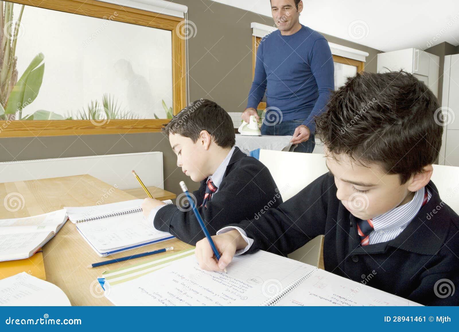 Kids Doing Homework, Dad Ironing. Stock Image - Image of caring, house ...