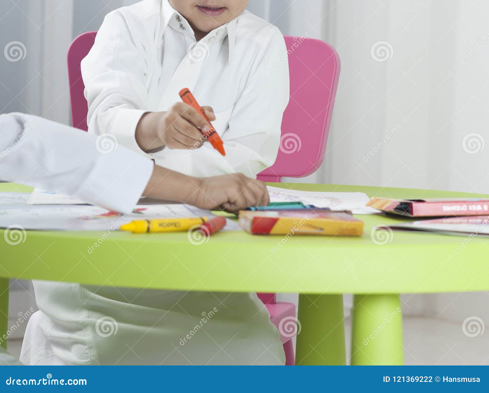Kids Drawing With Colored Crayons At A Table Editorial Image ...