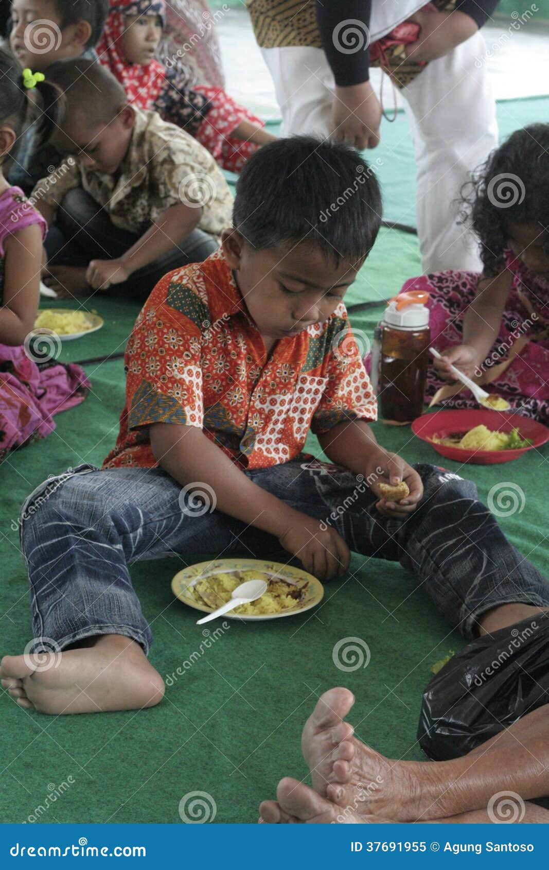 KIDS EAT RICE CELEBRATION DAY PRESS Editorial Image - Image of batik ...
