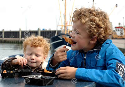 Kids eating fish stock image. Image of fishing, sibling - 6427731