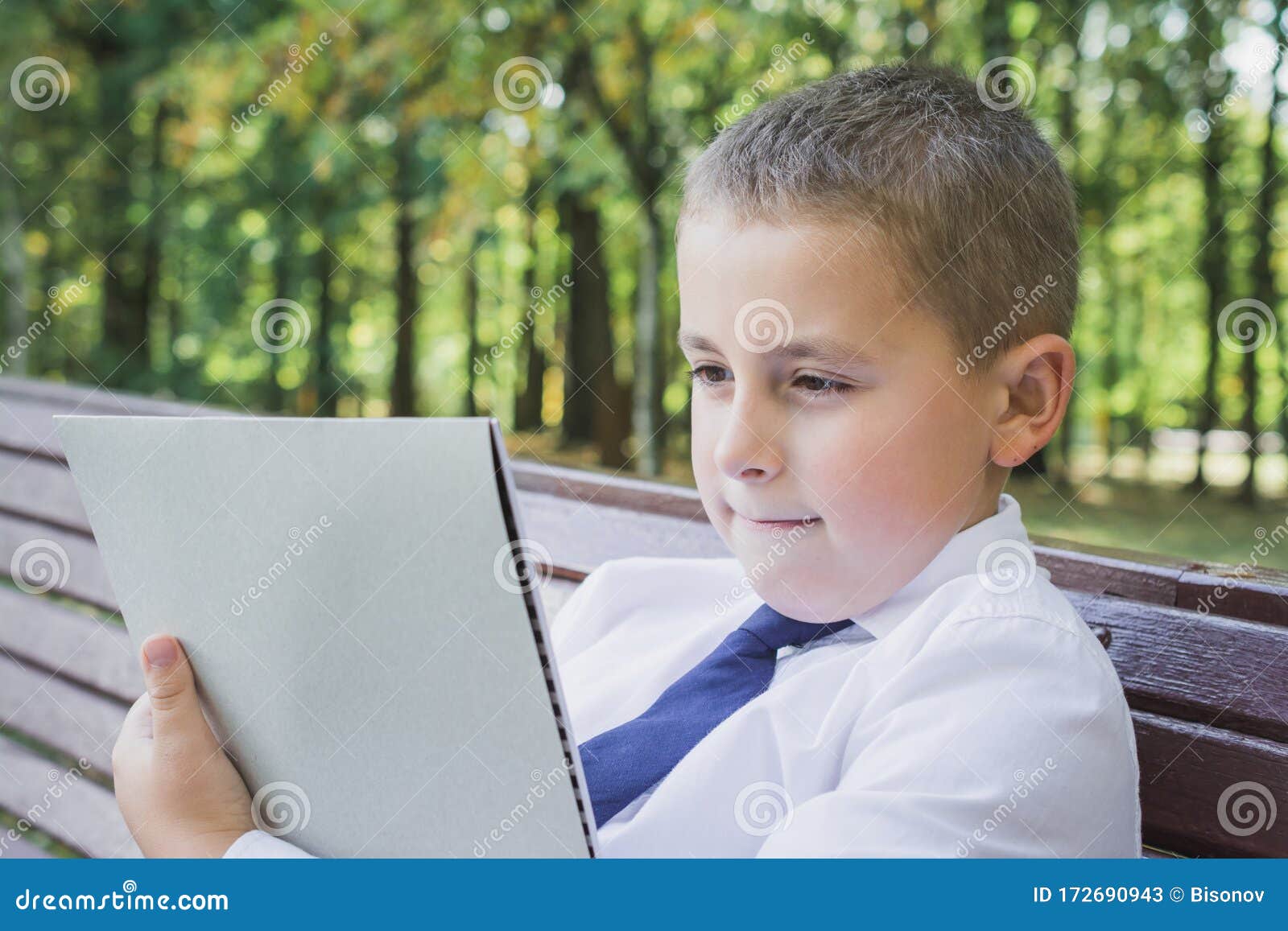 Kids Educations Concept, Boy with a Notebook in Hand and a Pencil Stock ...
