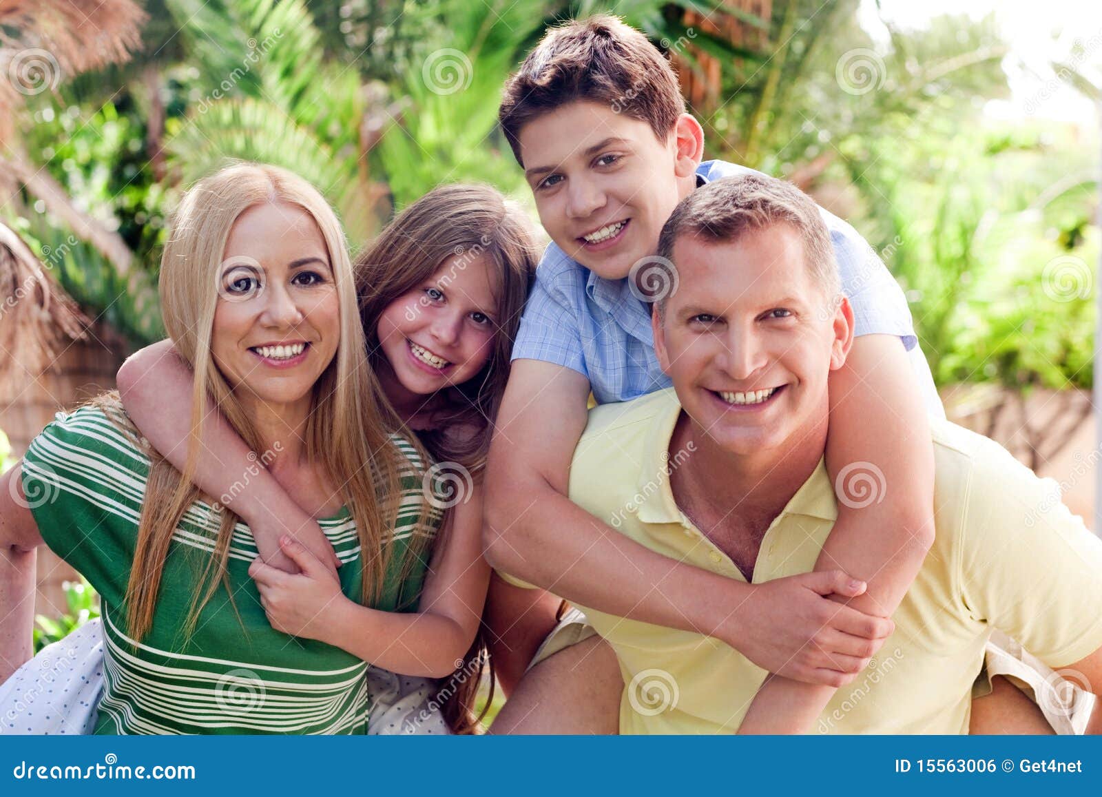 Kids enjoying piggy ride stock photo. Image of parents - 15563006