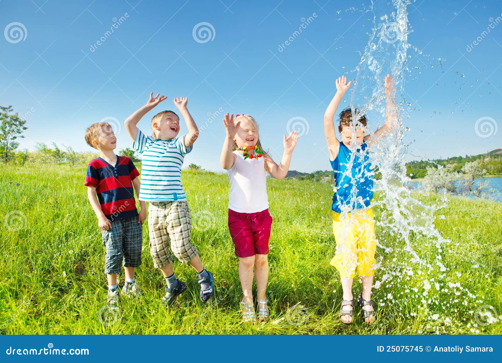 Kids Enjoying Water Splashes Stock Image - Image of jump, grass: 25075745