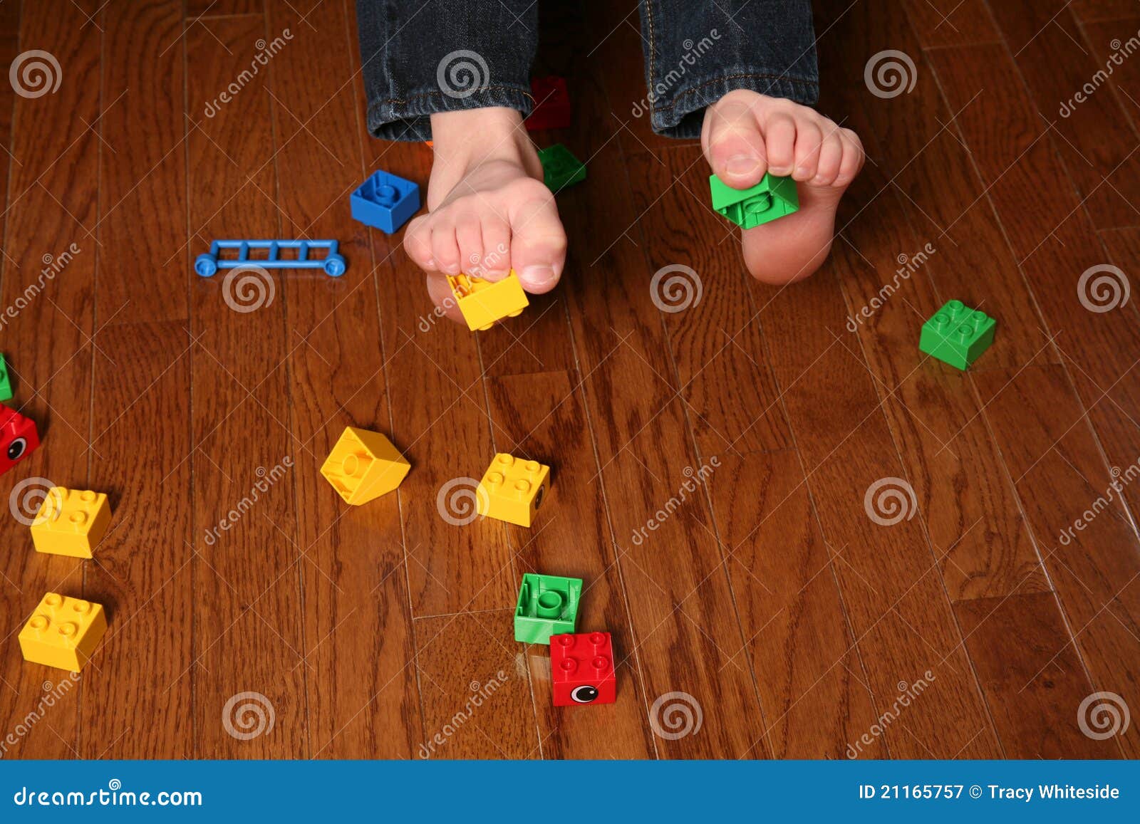 Kids feet pickup up blocks stock image. Image of footcare - 21165757