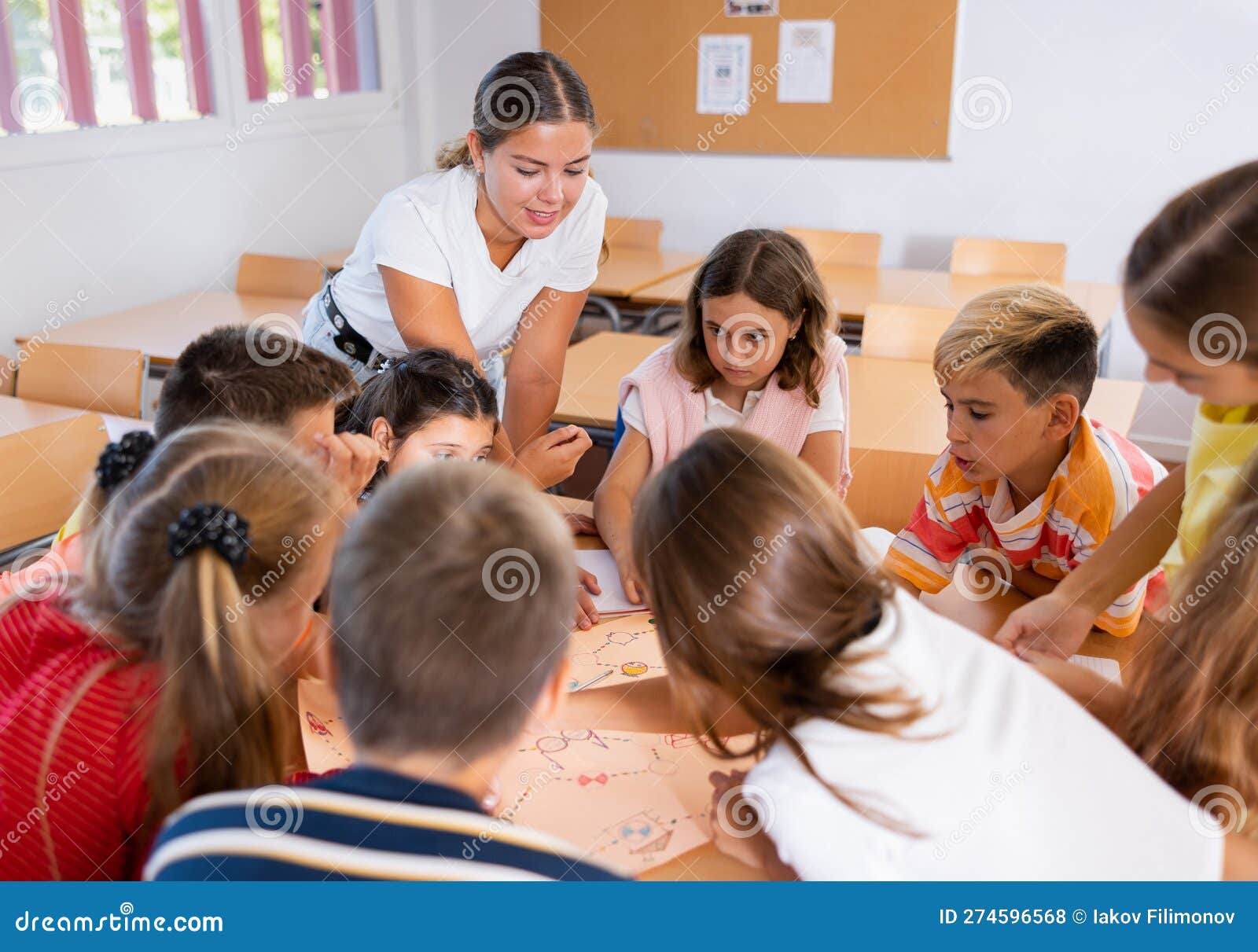 Kids and Female Teacher Playing Together Educational Board Game in ... Kids and Female Teacher Playing Together Educational Board Game in ...