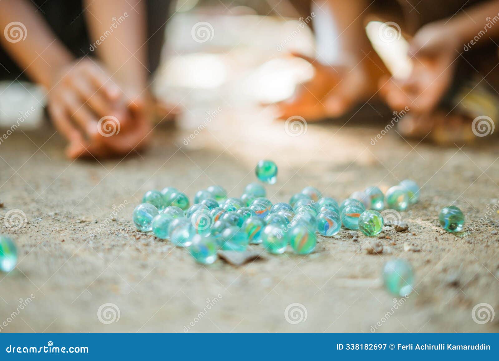 Kids Hand Hitting Marbles on the Ground Stock Image - Image of hand ...