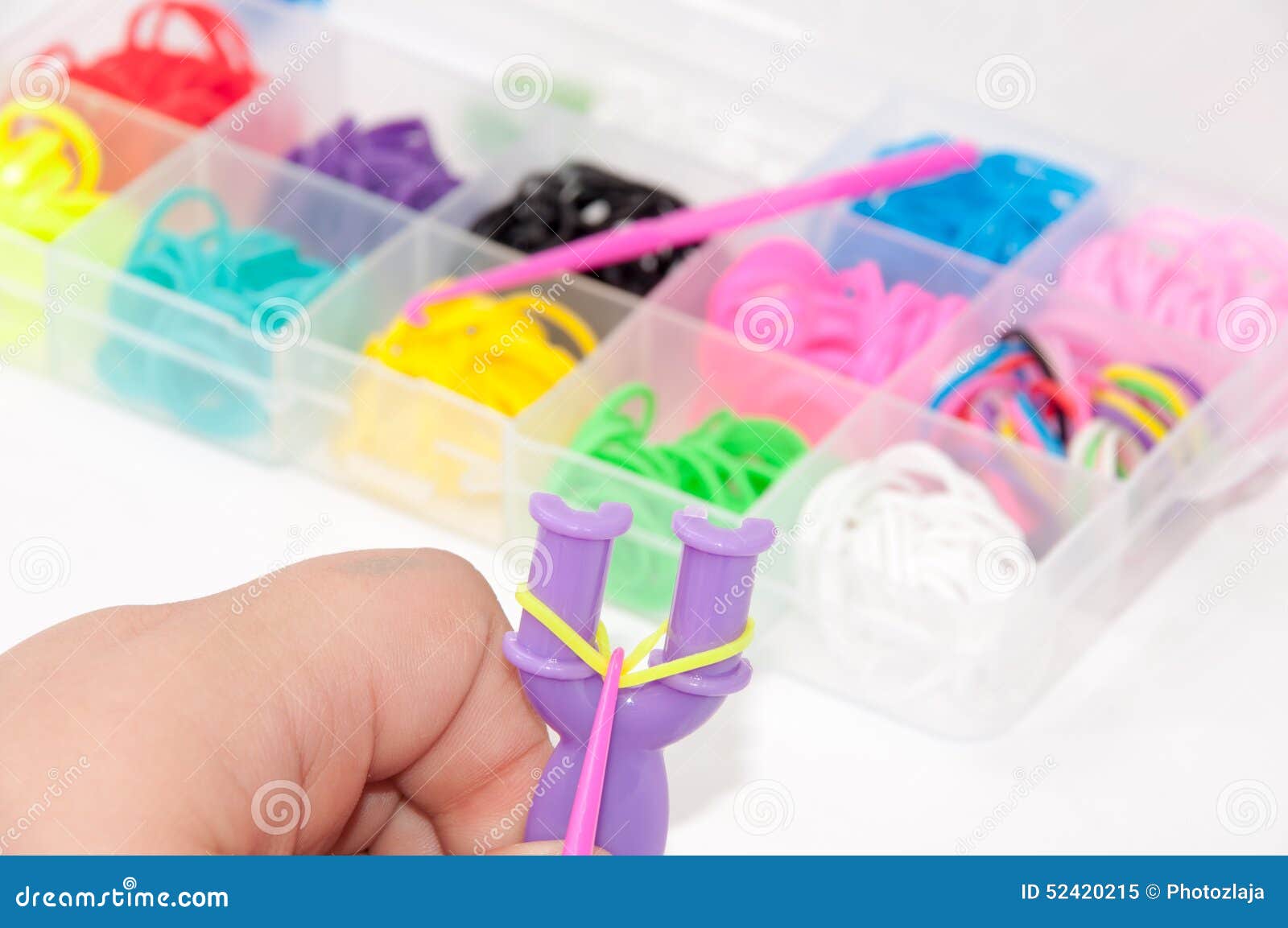 Kids Hands Creating Bracelet with Rubber Bands and Box in the Ba Stock ...