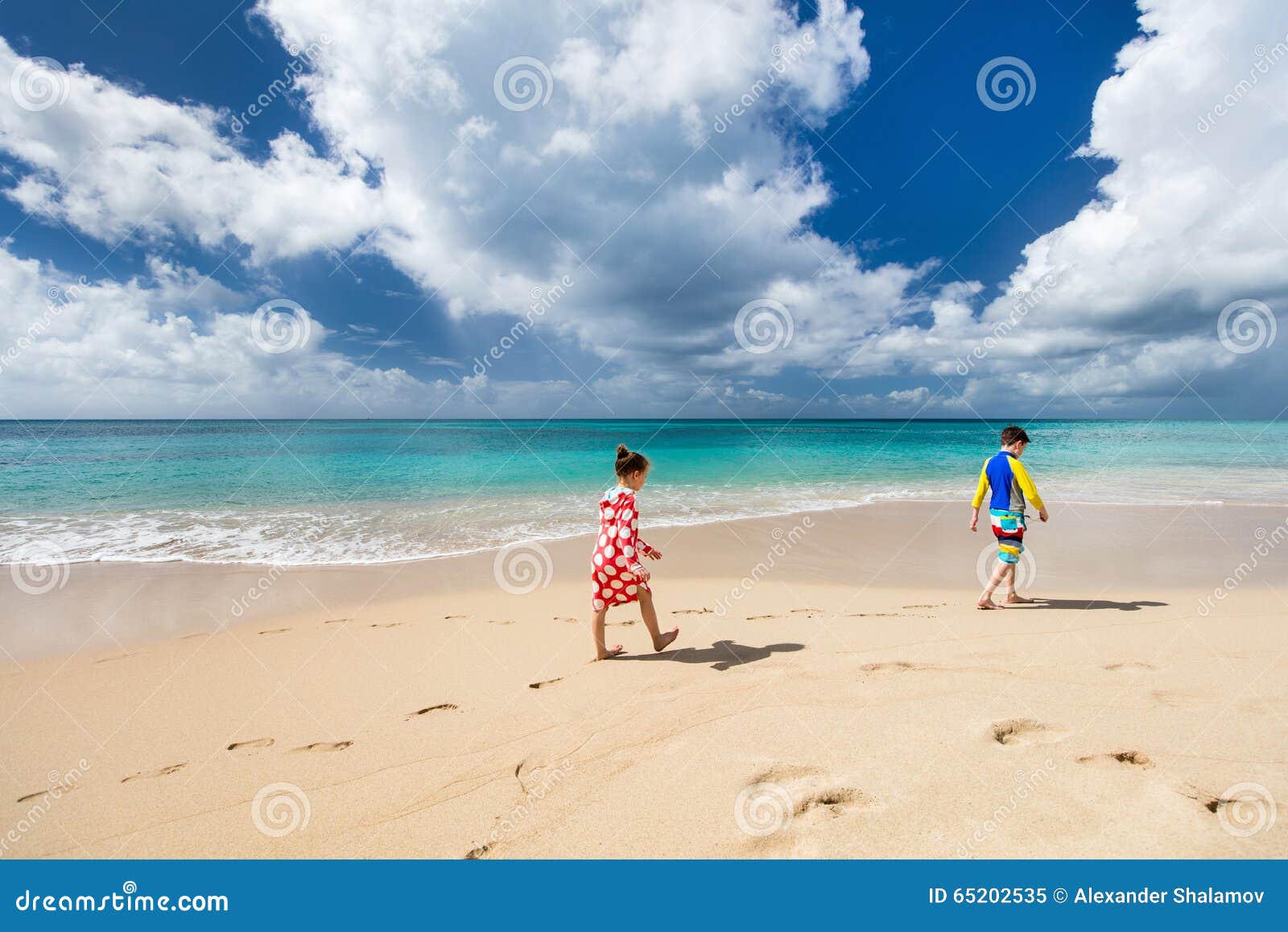 Kids having fun at beach stock image. Image of ocean - 65202535