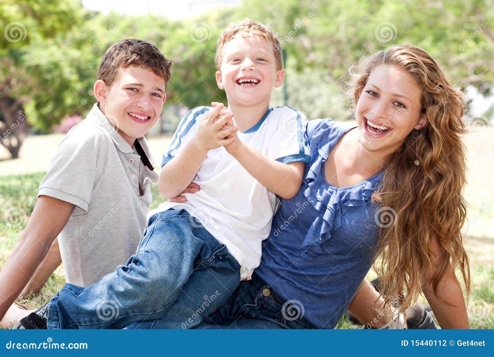Kids having fun with mum stock photo. Image of grass - 15440112
