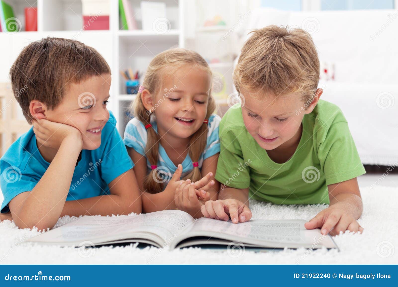Kids having fun reading stock photo. Image of person - 21922240