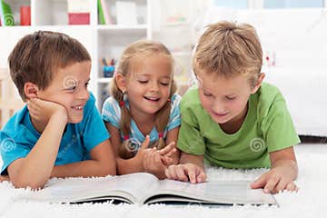 Kids having fun reading stock photo. Image of person - 21922240