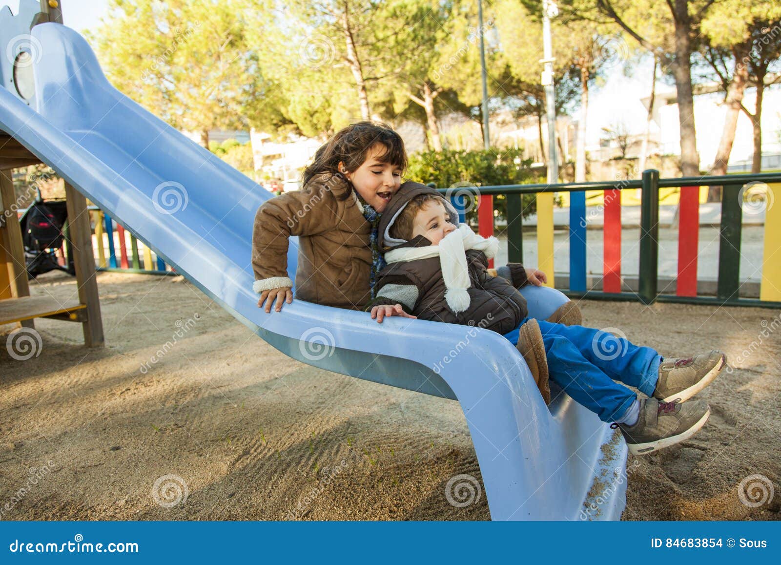 Kids Having Fun on Slide at the Playground Stock Photo - Image of ...