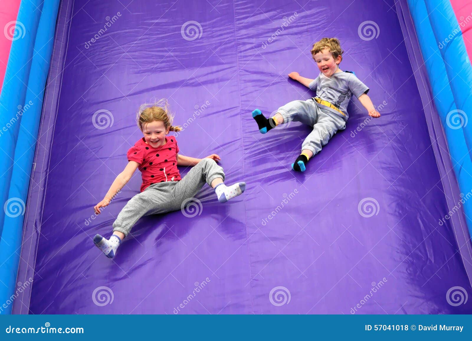 Kids Having Fun on Slide stock photo. Image of summer - 57041018
