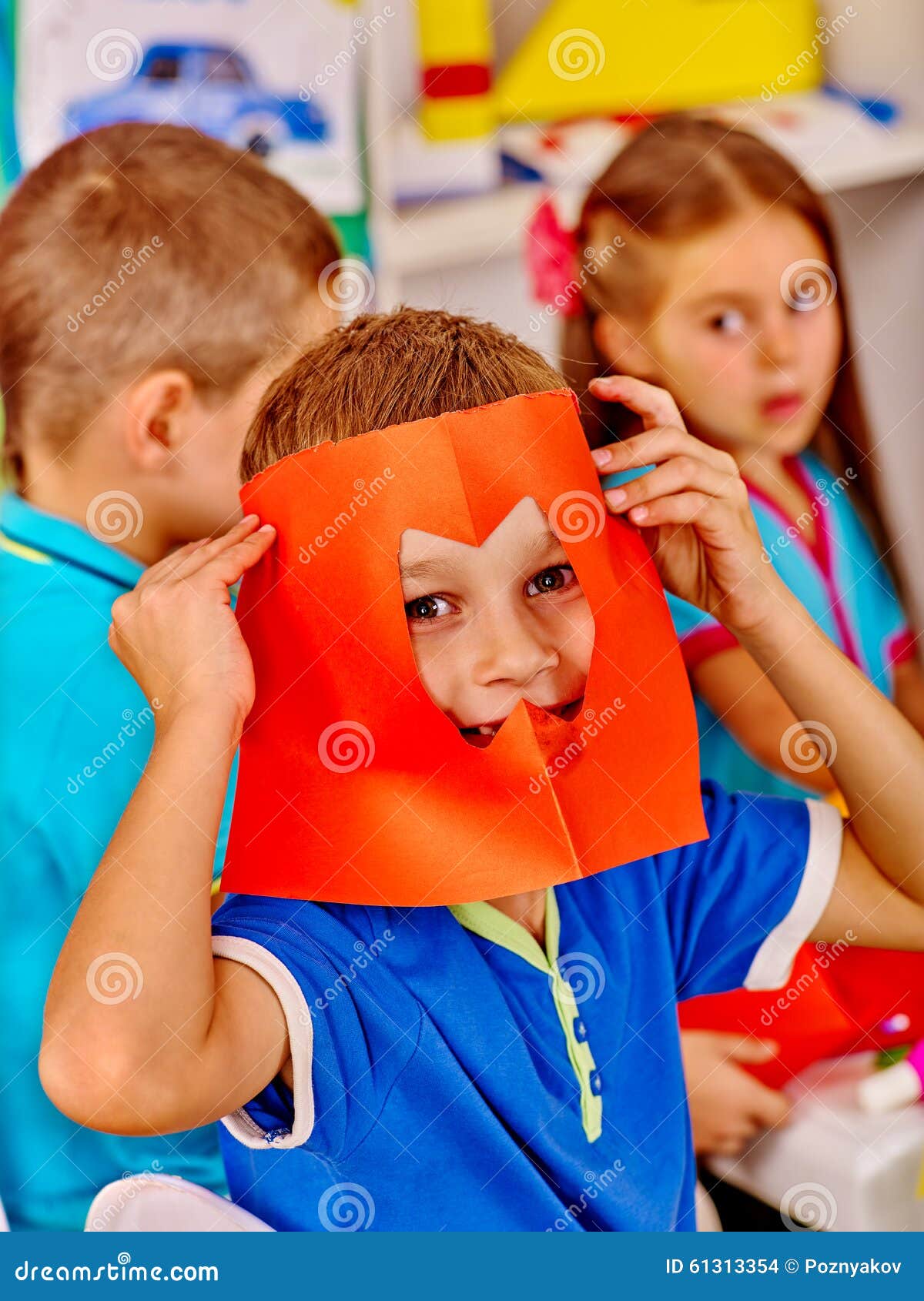 Kids Holding Colored Paper on Table in Stock Photo - Image of lesson ...
