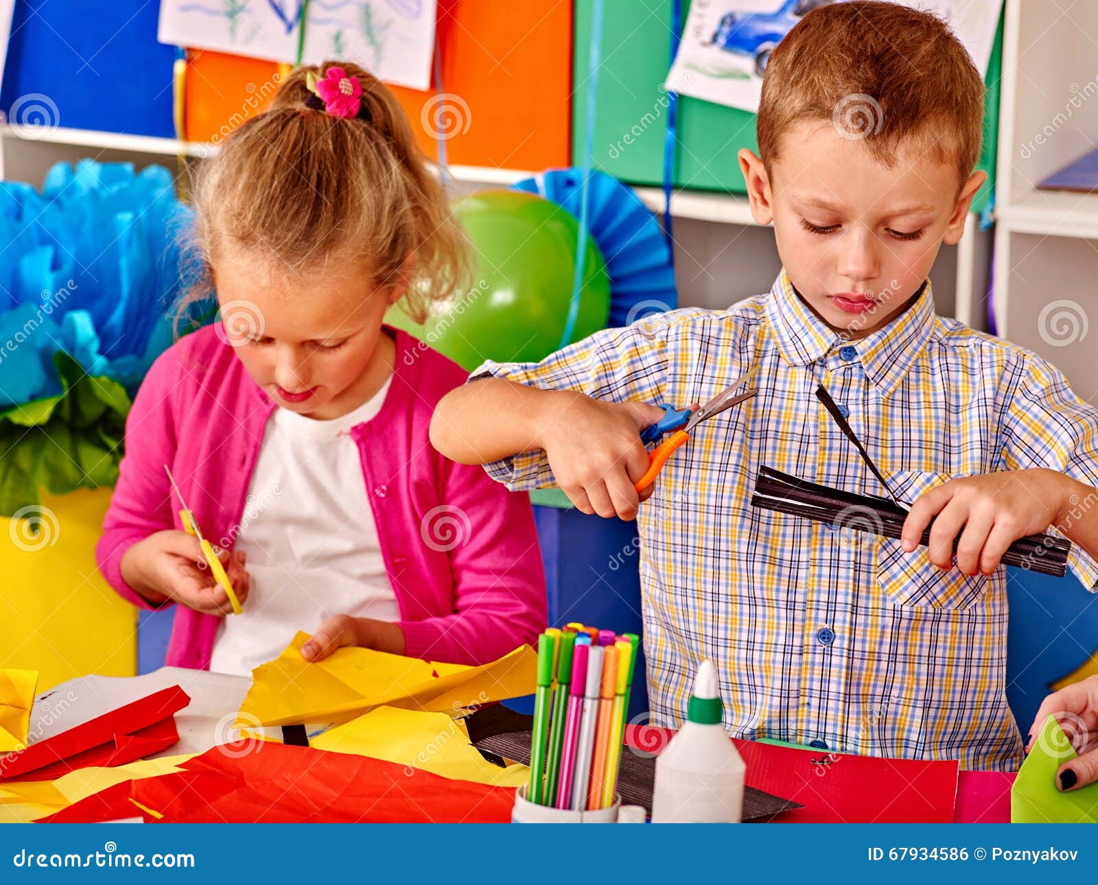 Kids Holding Colored Paper on Table in Kindergarten . Stock Photo ...