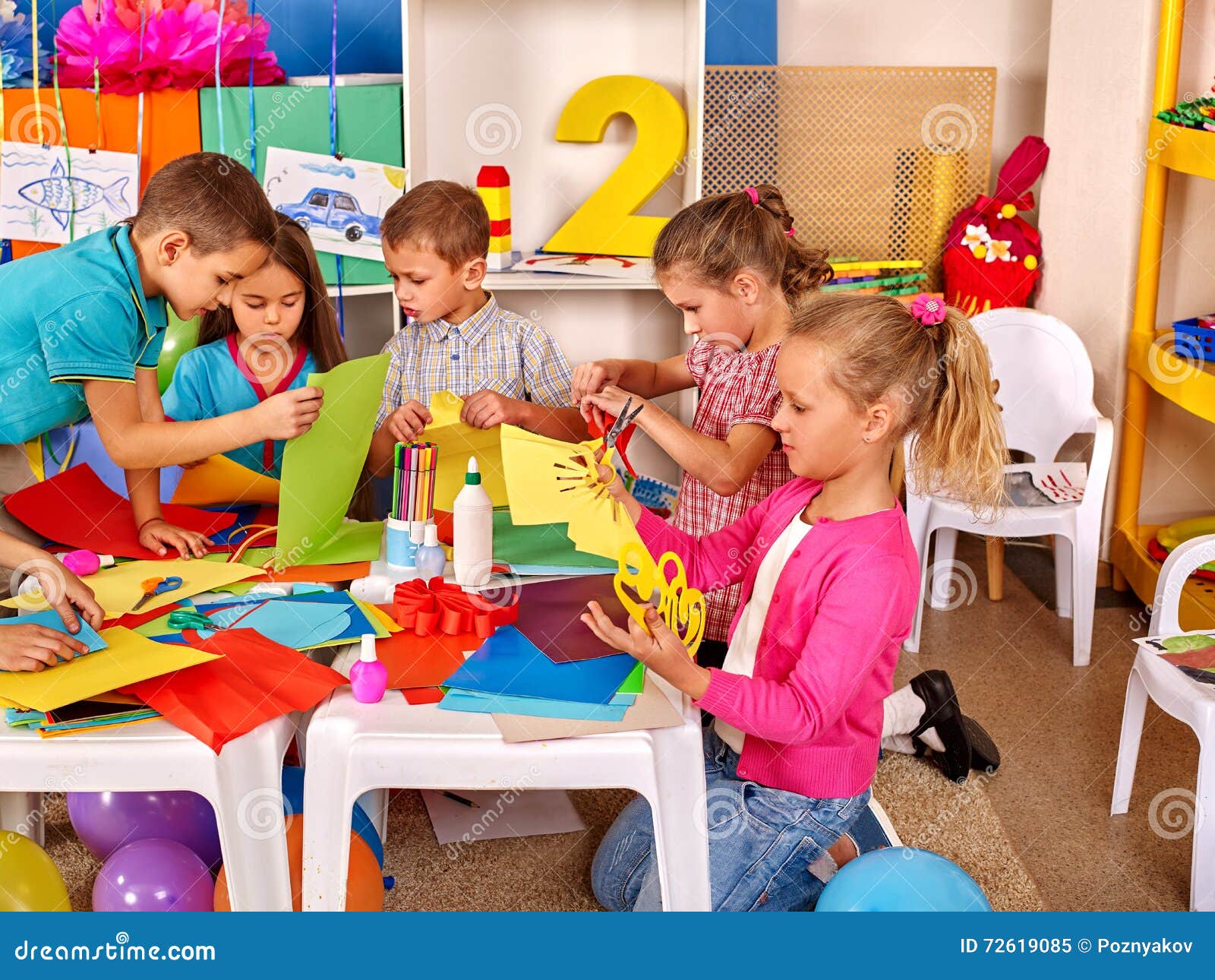 Kids Holding Colored Paper on Table in Kindergarten . Stock Image ...