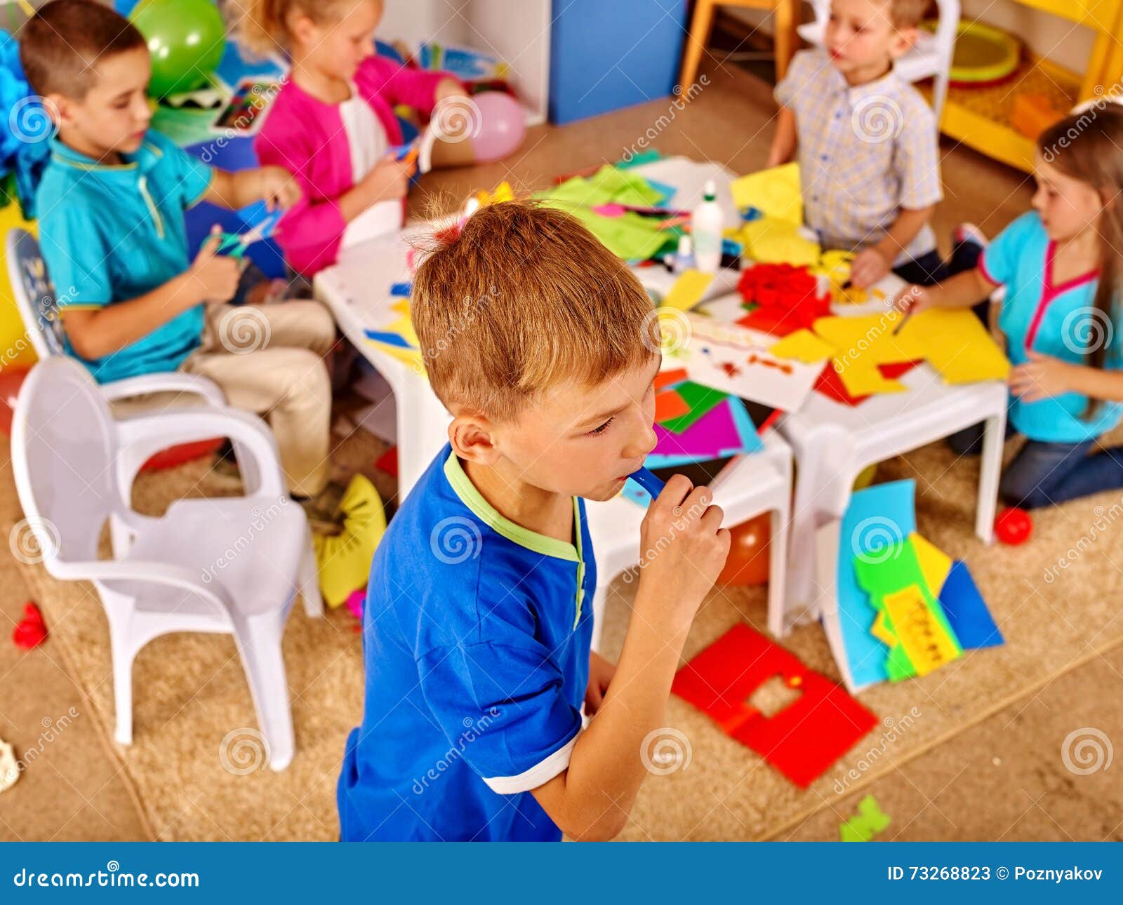 Kids Holding Colored Paper on Table in Kindergarten . Stock Image ...