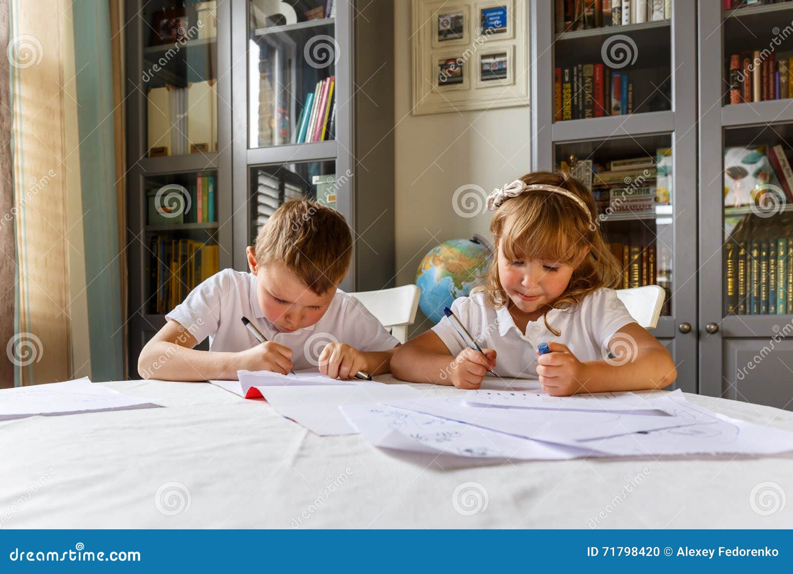 Kids at homework stock photo. Image of britain, cute - 71798420