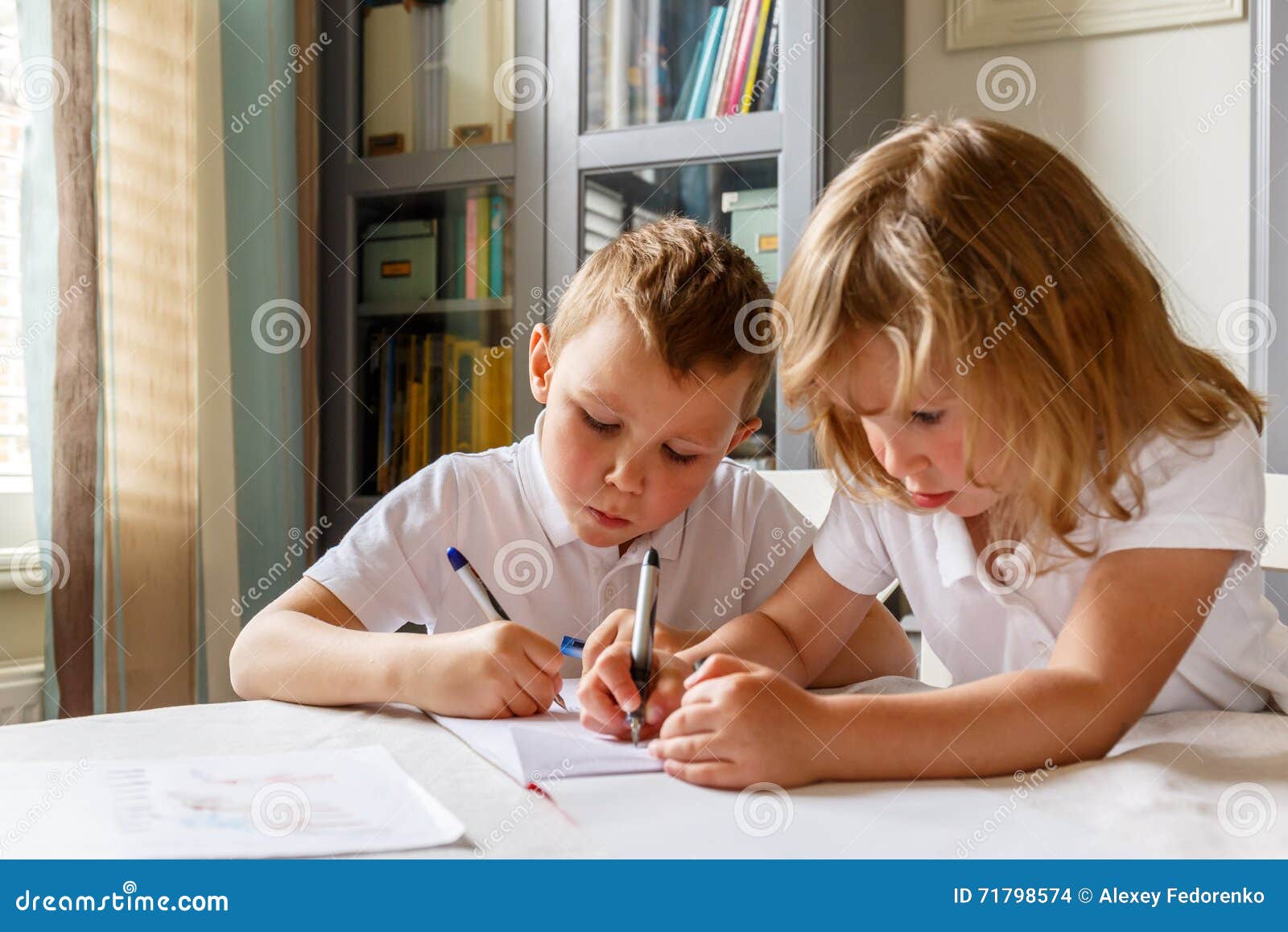 Kids at homework stock photo. Image of britain, kingdom - 71798574