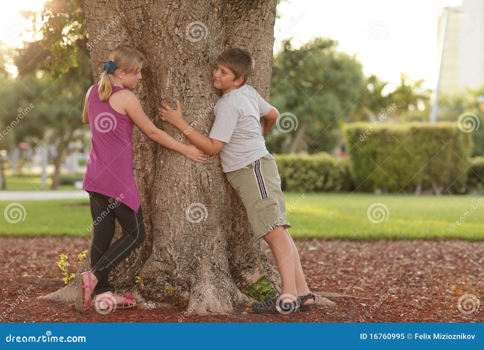 Kids hugging the tree stock image. Image of couple, female - 16760995