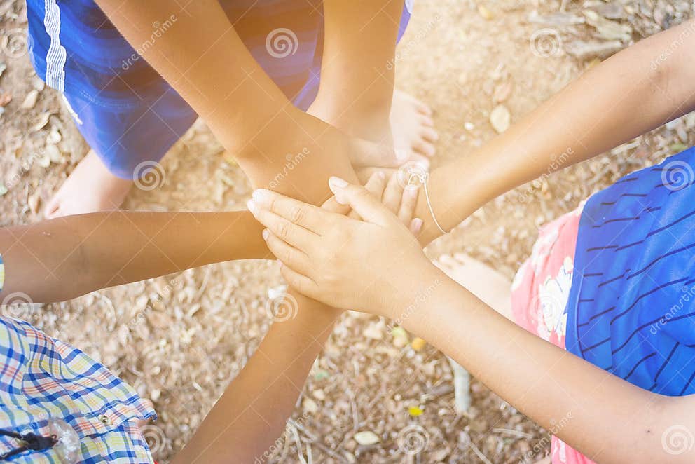 Kids join hands stock photo. Image of partnership, success - 80051908