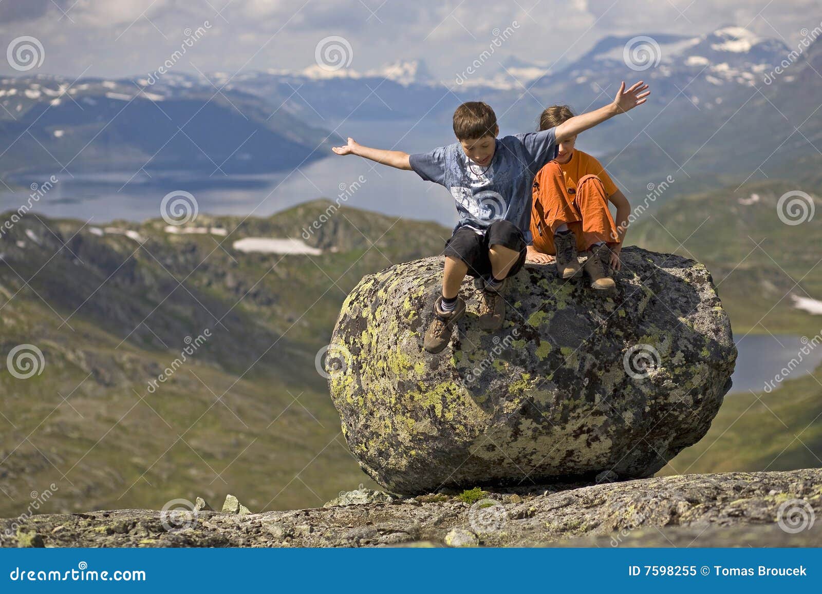 Kids Jumping from Big Stone Stock Image - Image of rock, mountains: 7598255