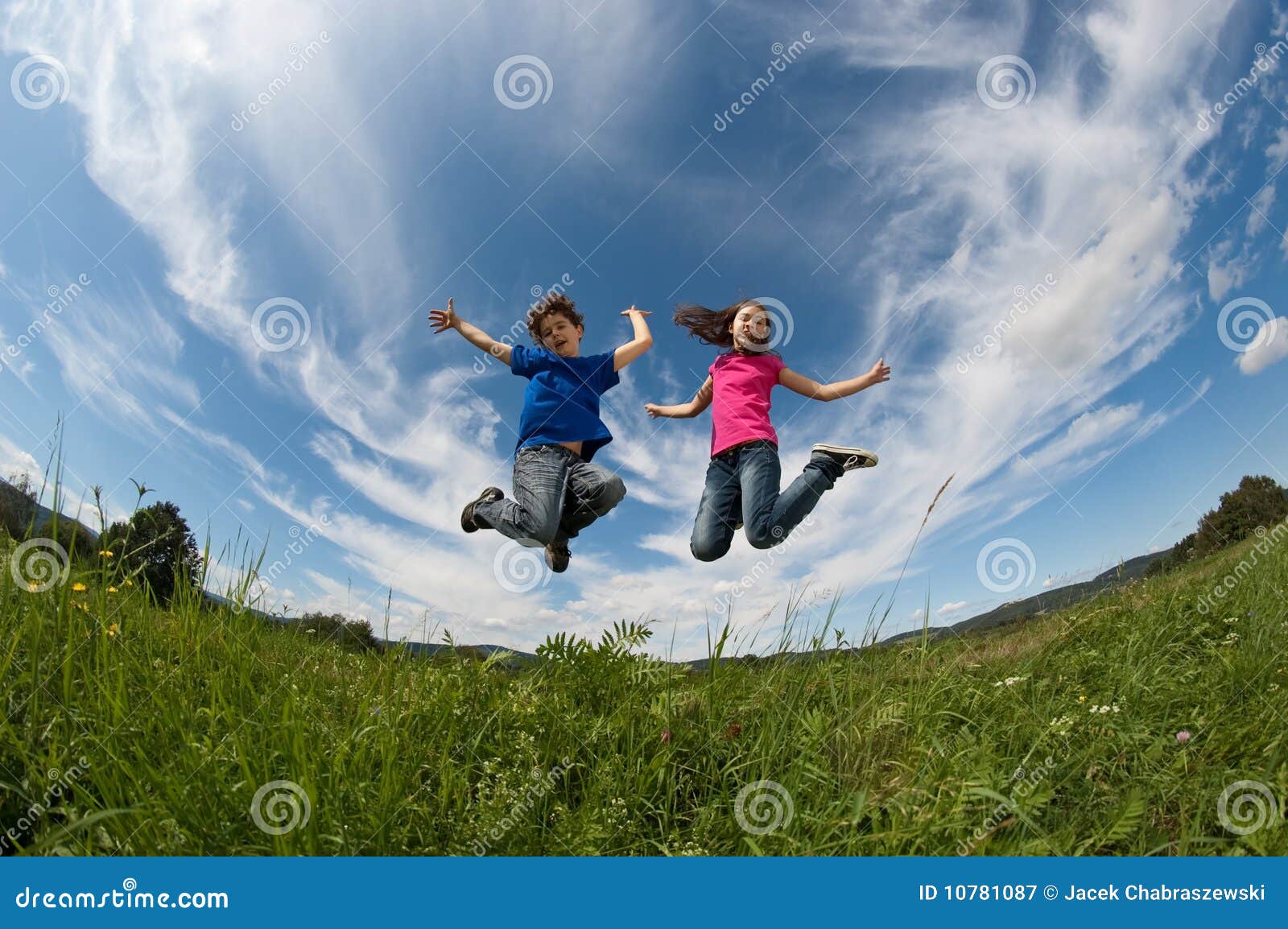Kids jumping outdoor stock image. Image of childhood - 10781087