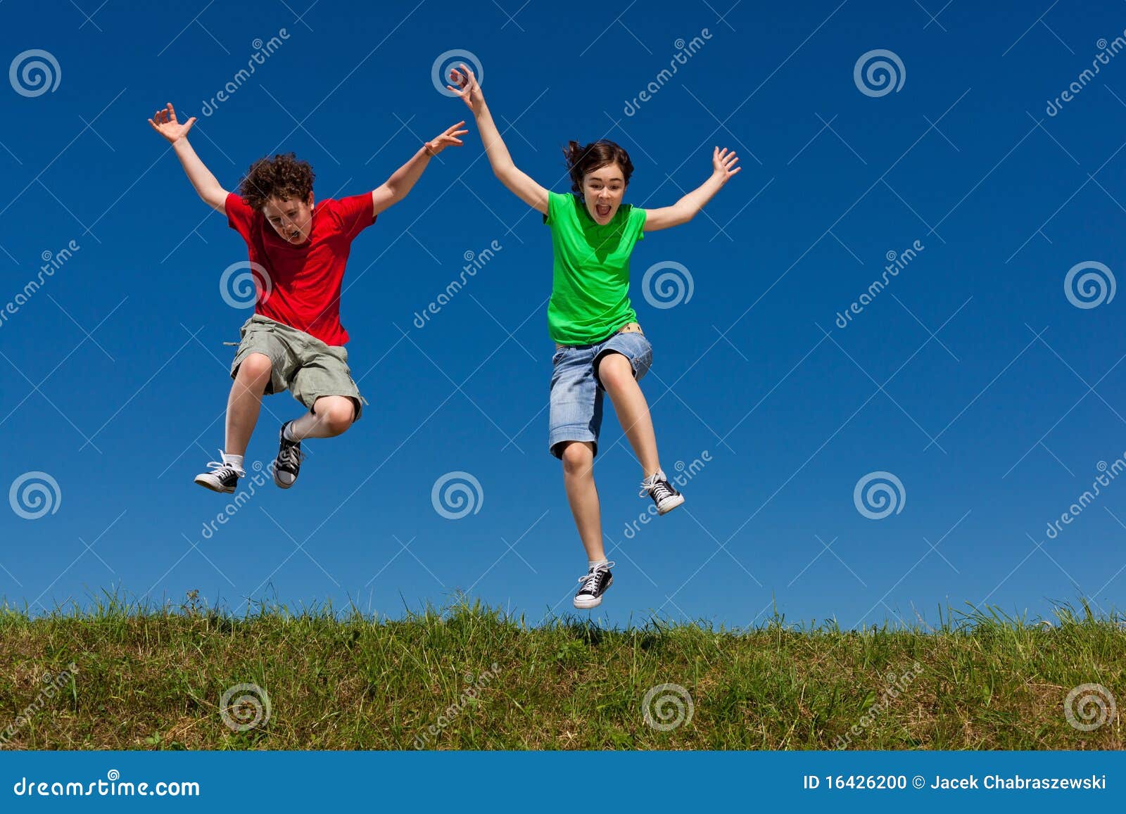 Kids jumping outdoor stock photo. Image of child, freedom - 16426200