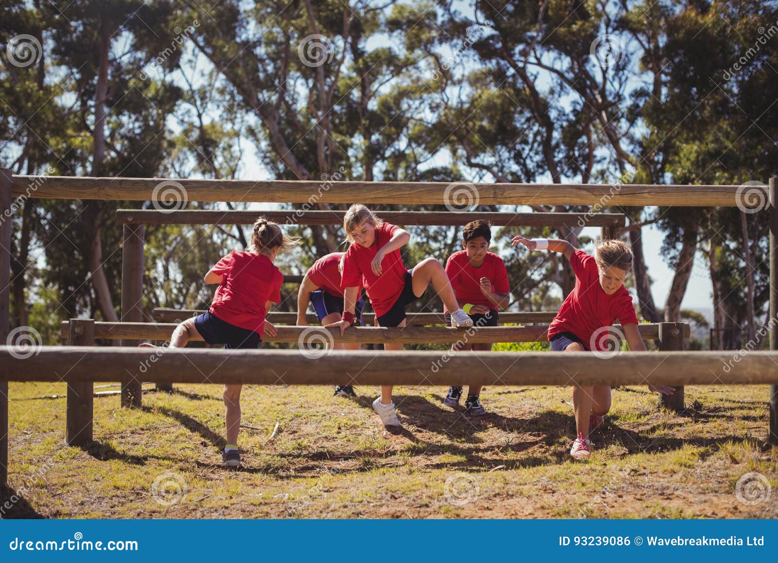 Kids Jumping Over the Hurdles during Obstacle Course Training Stock ...