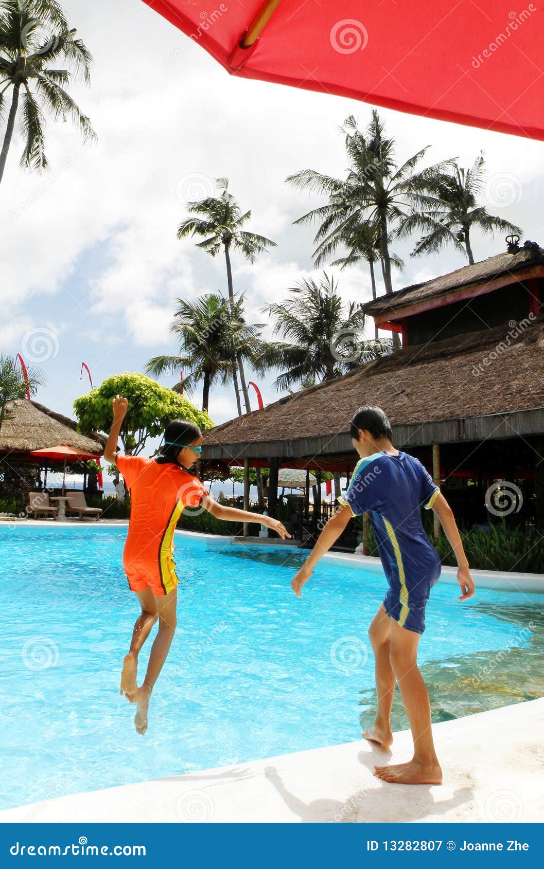 Kids Jumping into Resort Pool Stock Image - Image of happy, child: 13282807
