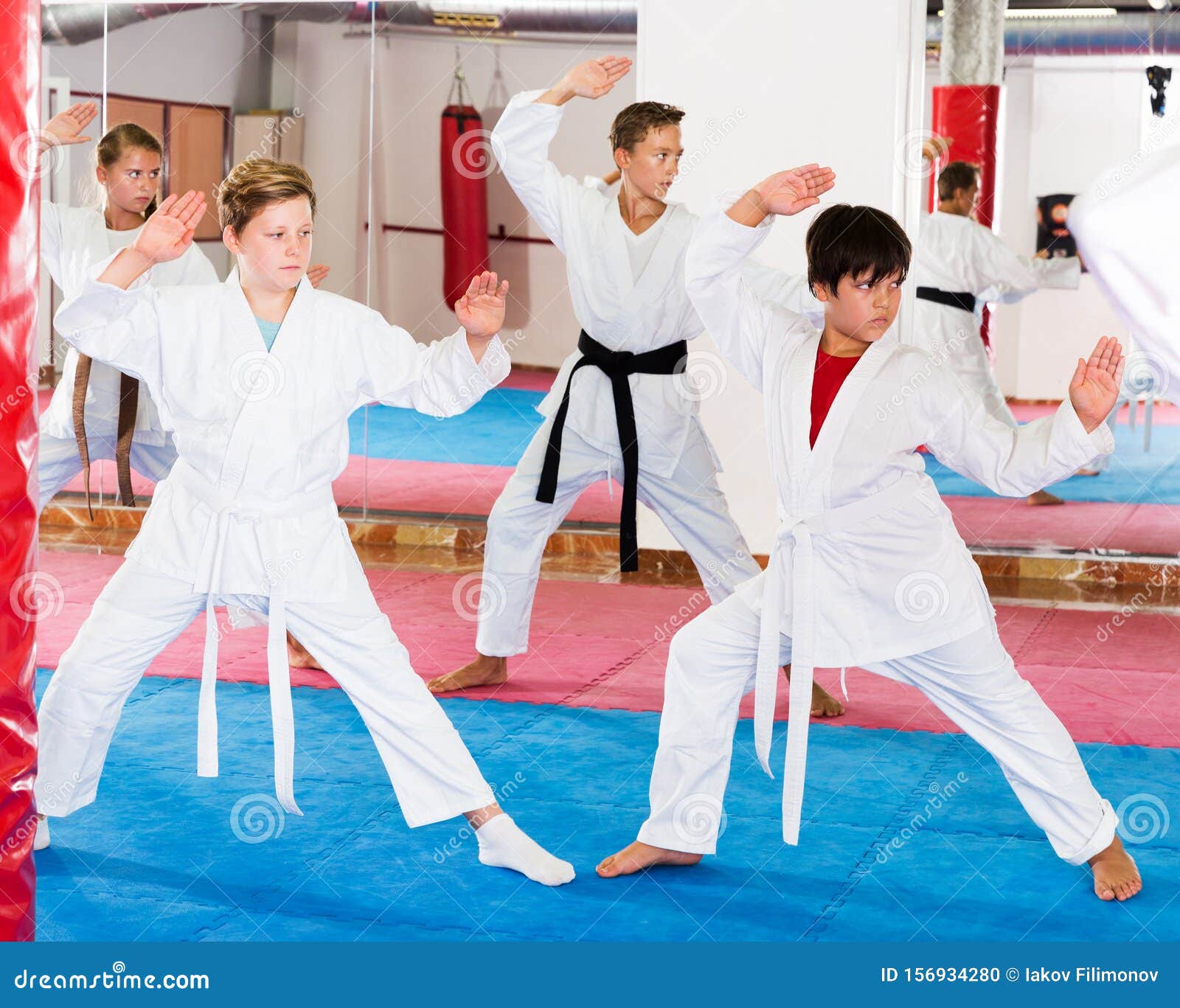 Kids in Kimonos Practicing Effective Karate Techniques Stock Photo ...